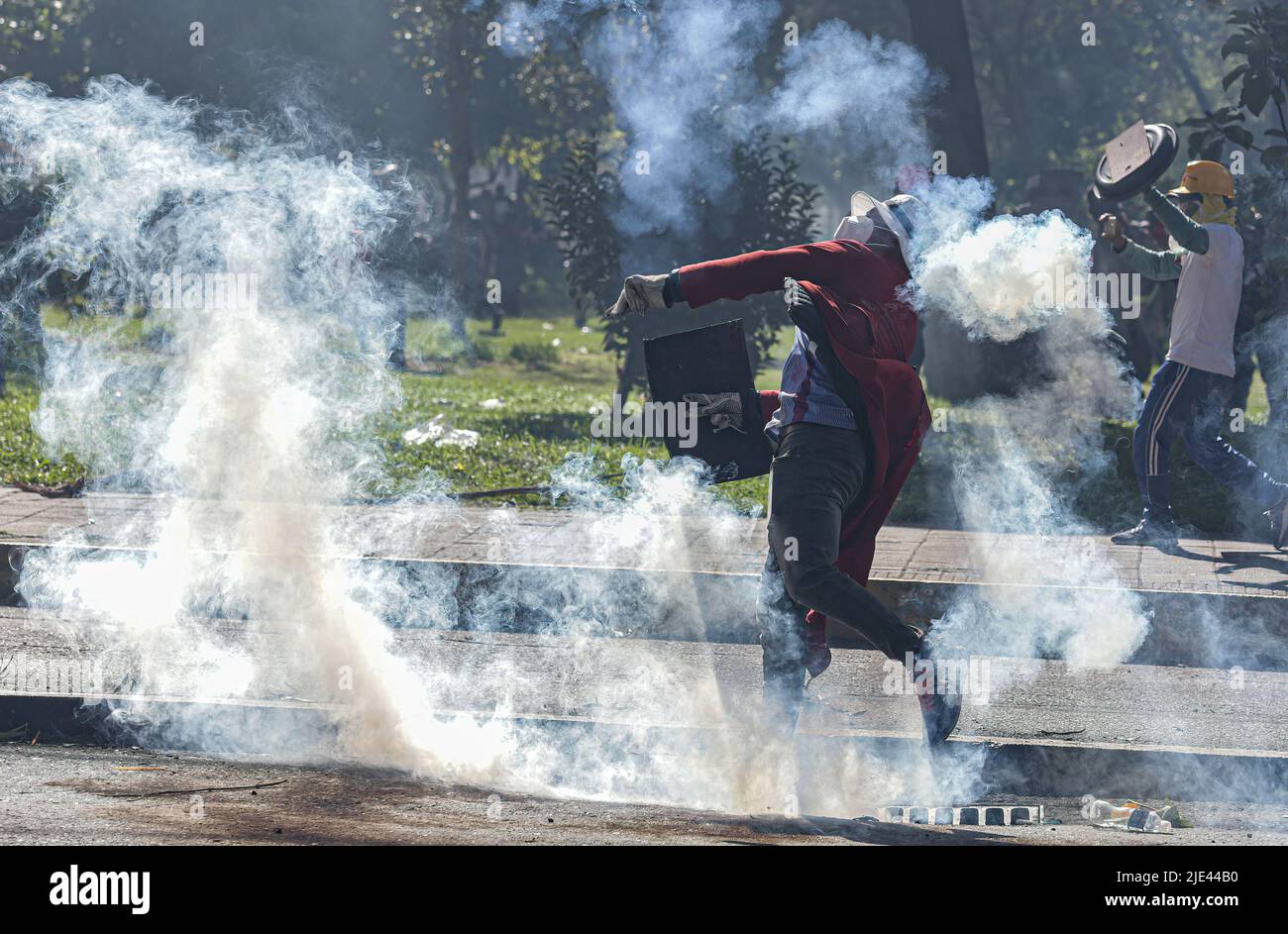 Quito, Ecuador. 23rd June, 2022. Protesters throw teargas bomb dropped ...