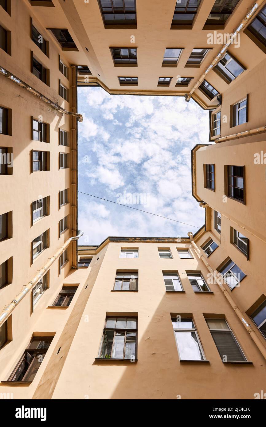 Photograph of sky inside courtyard of well Stock Photo - Alamy