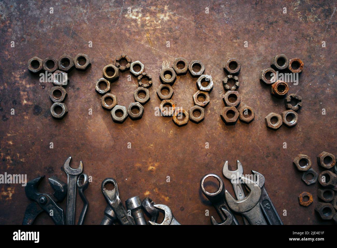 the word Tools written by nuts and a set of wrenches Stock Photo - Alamy