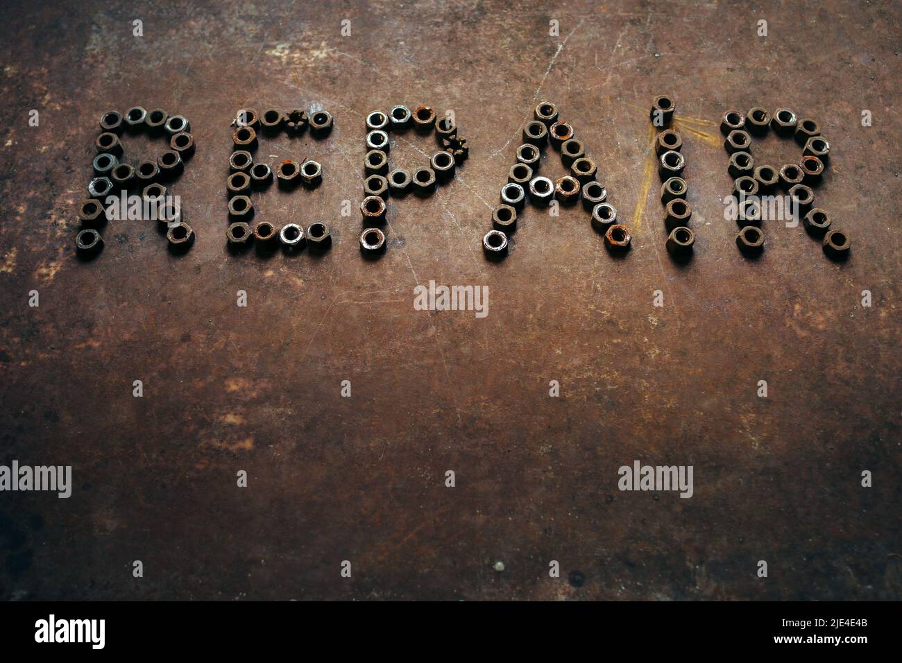 Metal texture and word Repair Stock Photo - Alamy