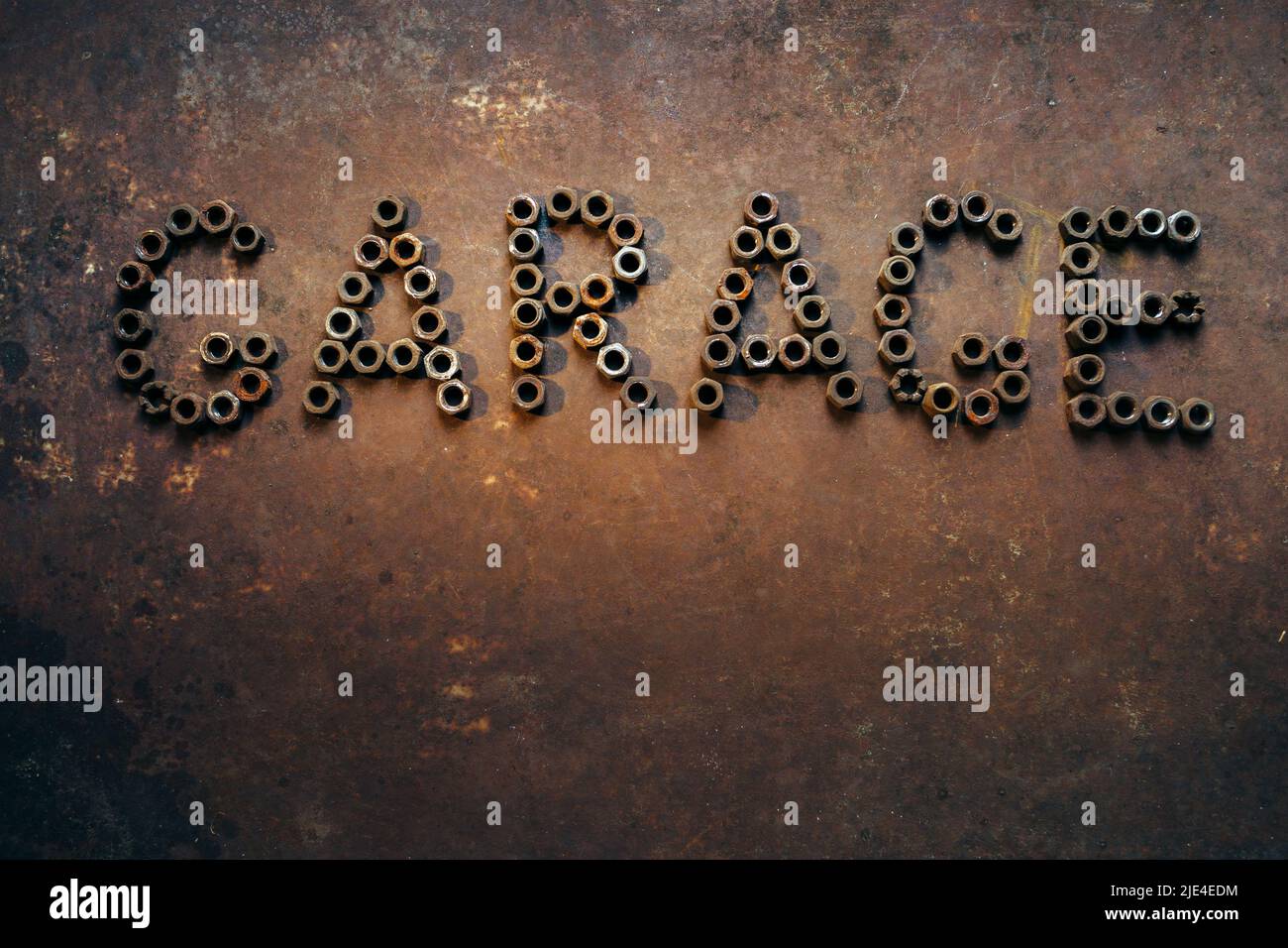 the sign Garage, written by old nuts Stock Photo - Alamy
