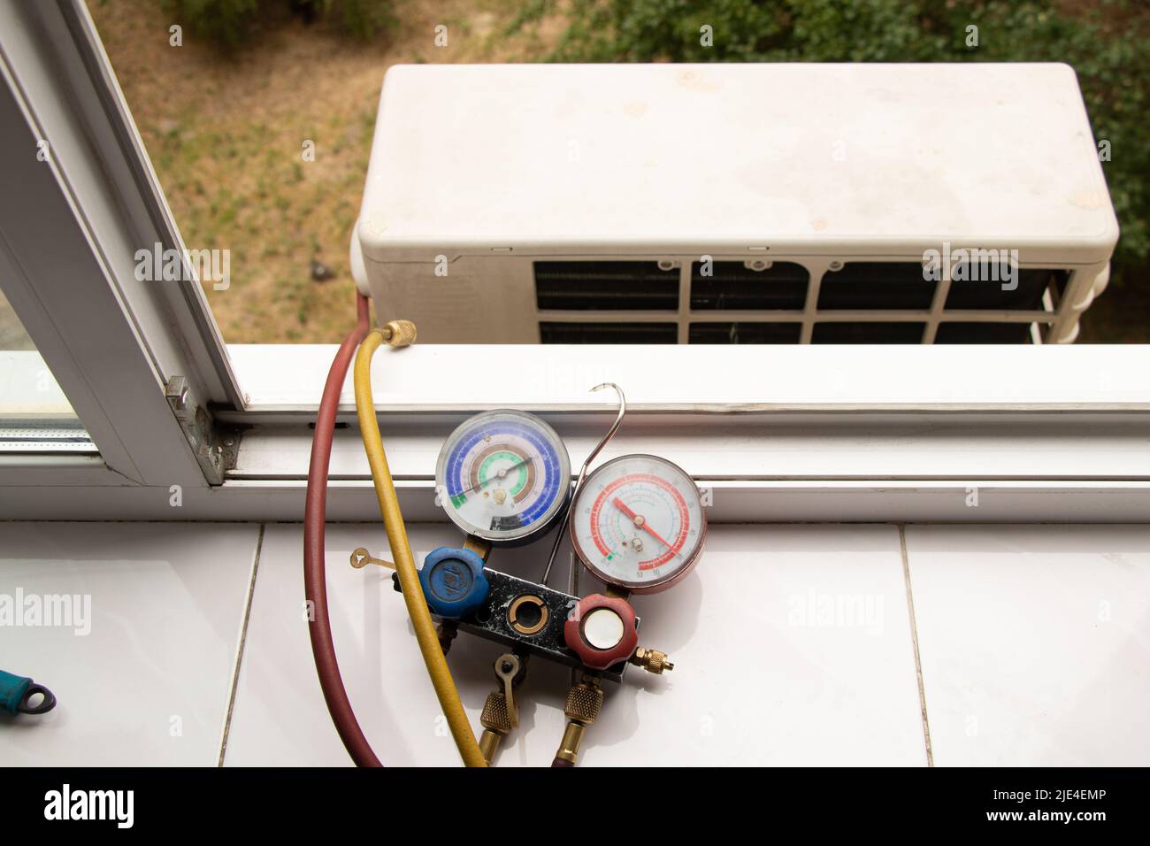 The two-valve manometric manifold lies on the windowsill in the ...