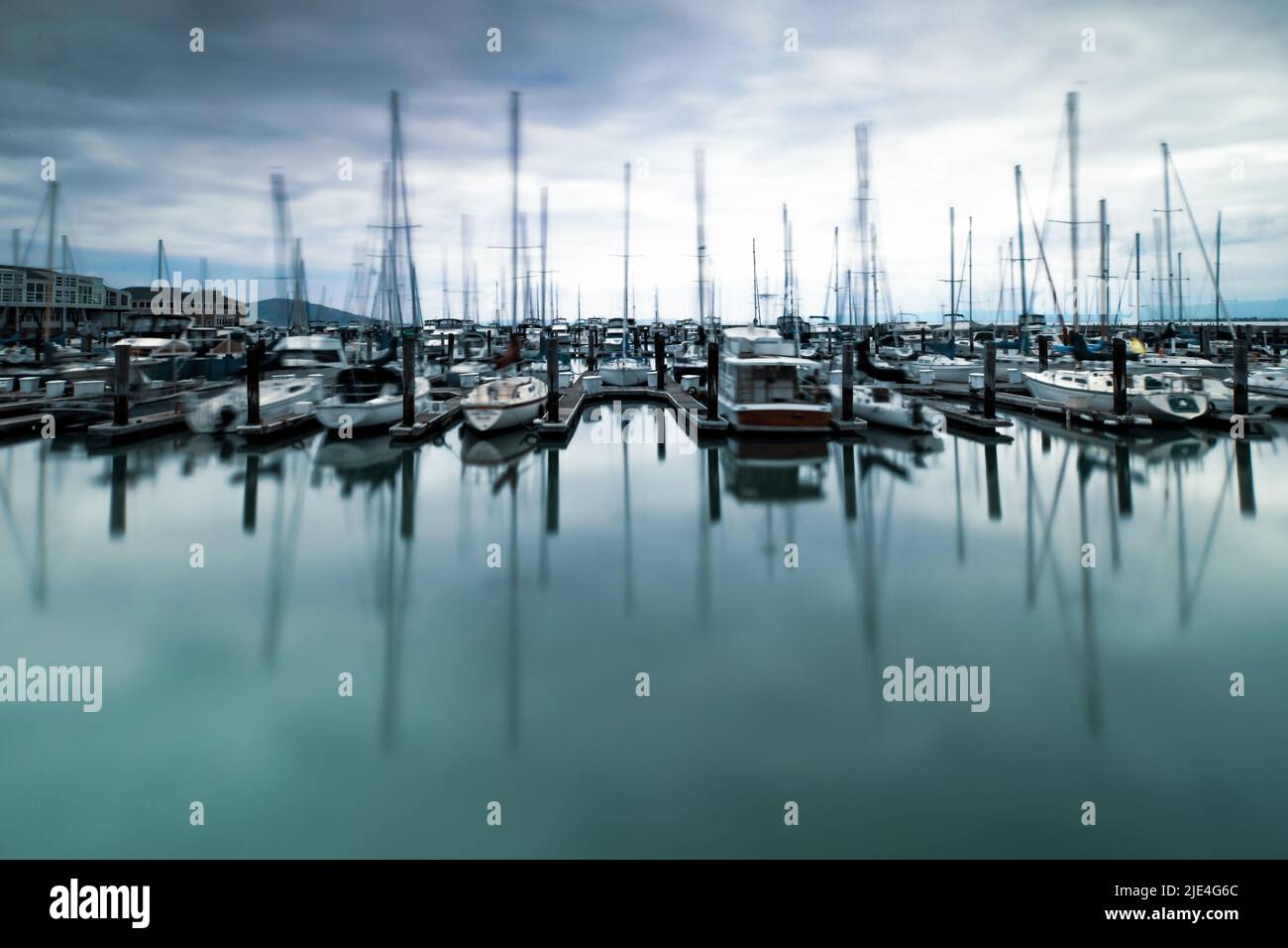 Sunset, calm harbor with yachts and masts Stock Photo - Alamy