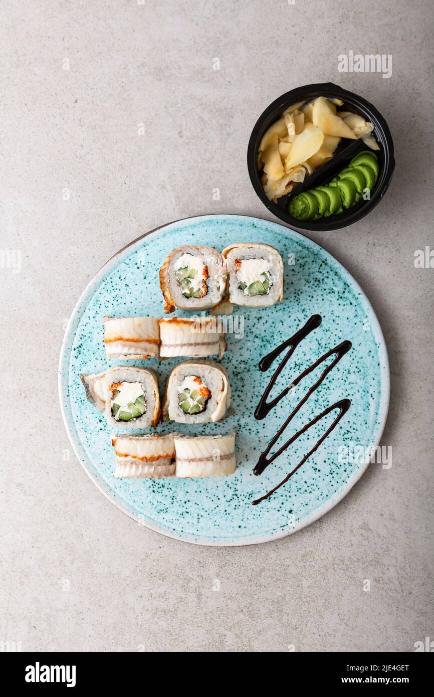 Overhead view of fish sushi with avocado and cream cheese Stock Photo ...