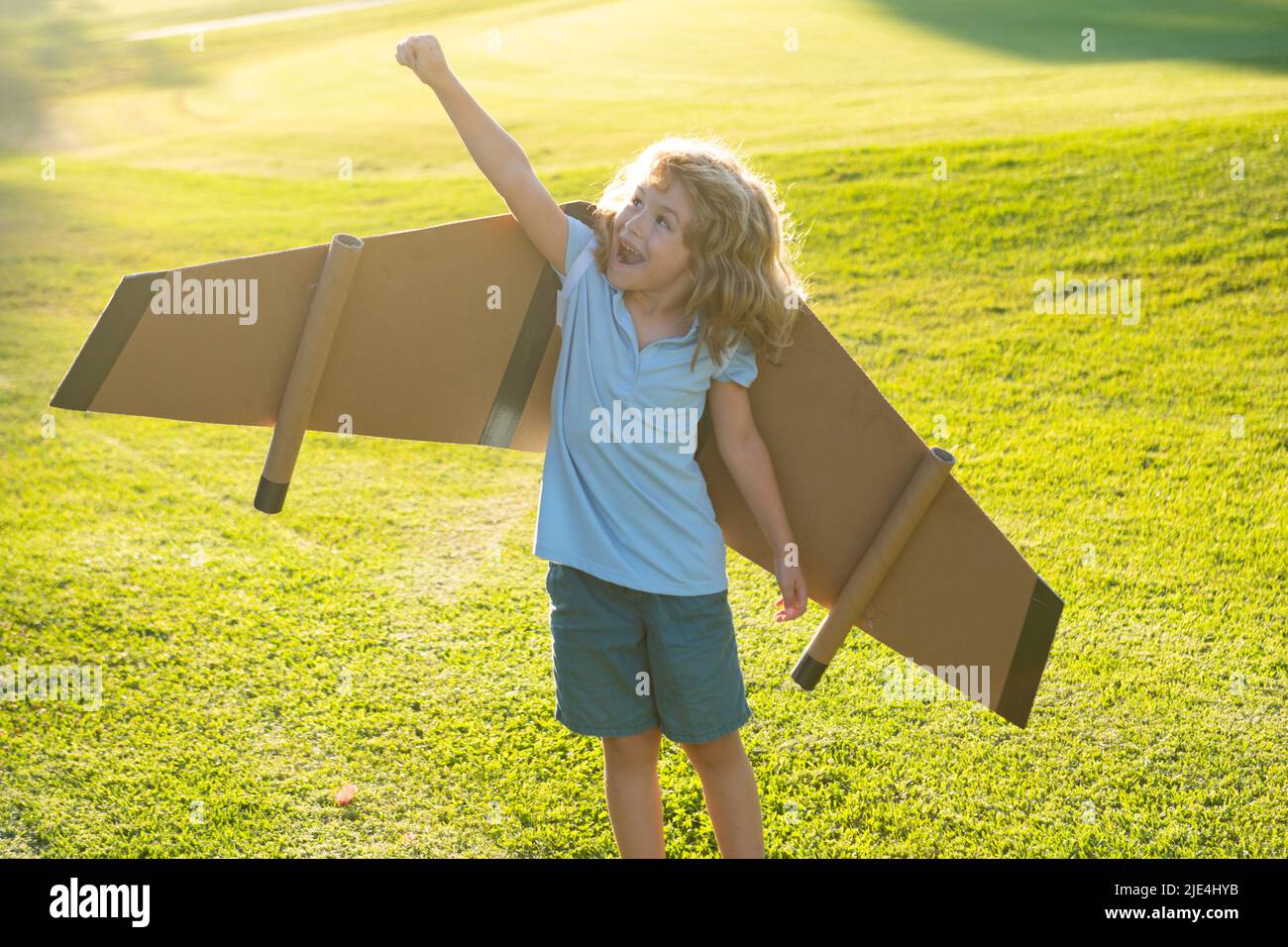 Kid superhero with jetpack. Child pilot play on summer day. Success ...