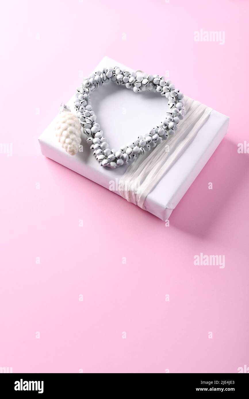 Christmas present on bright paper background. Close up. Copy space ...