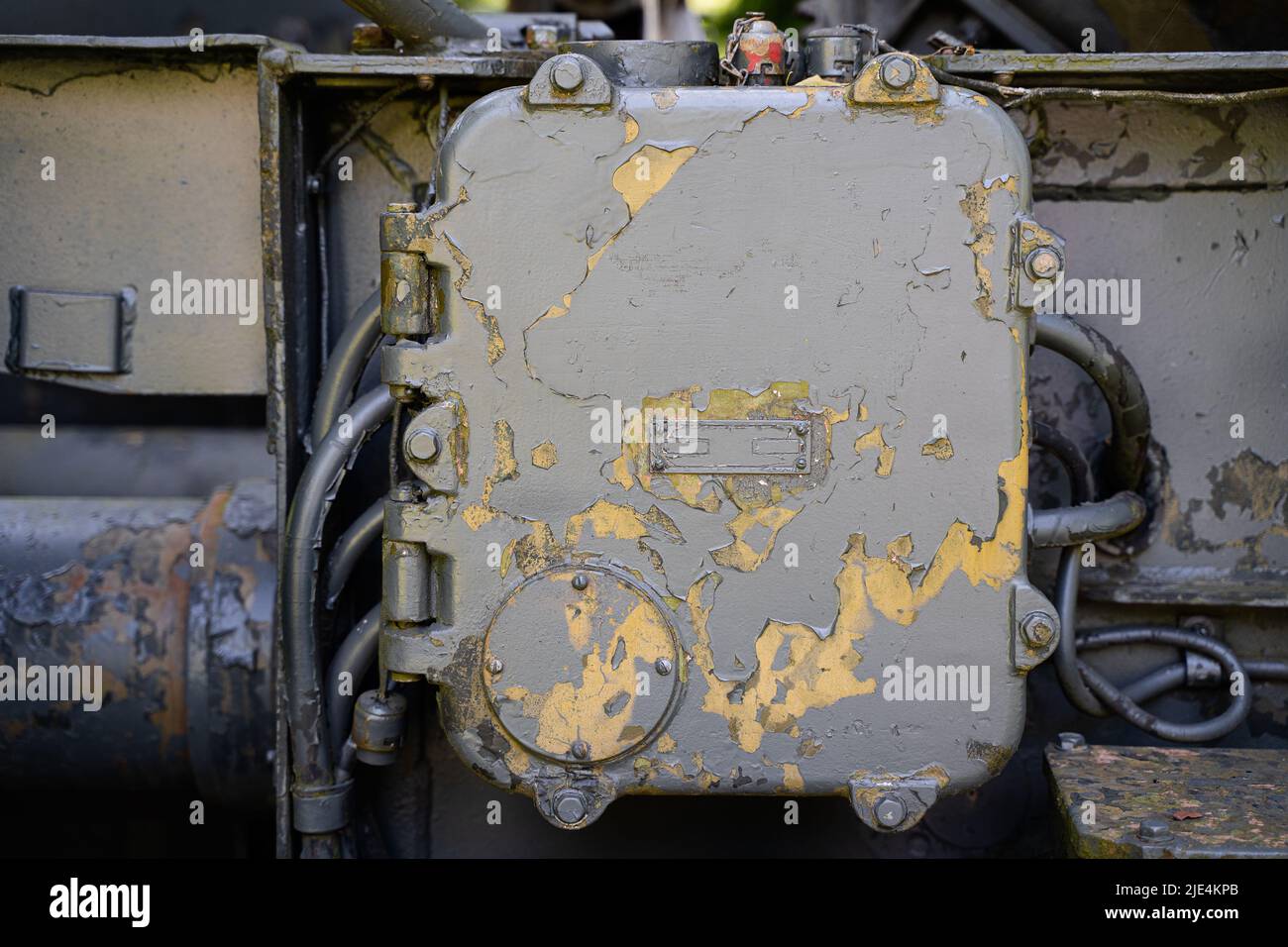 front view closeup of rusted metallic cabinet panel enclosure with ...