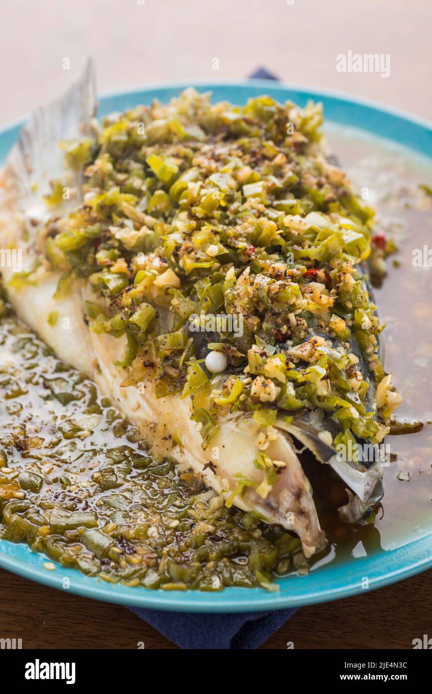 Blue porcelain dish of green pepper sauce braised oxtail fish head ...