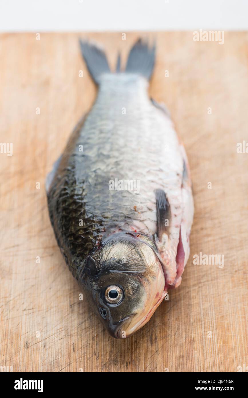 Clean fresh carp on the bamboo cutting board Stock Photo - Alamy