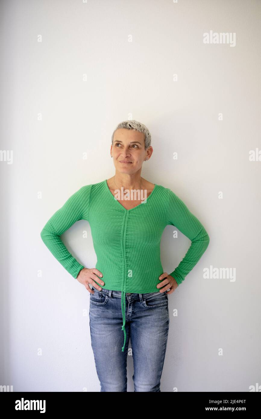 pretty, strong, confident, slim middle-aged woman with short, white ...