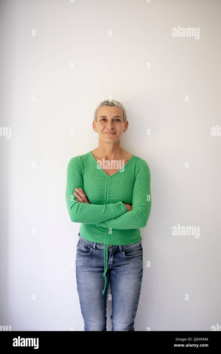 pretty, strong, confident, slim middle-aged woman with short, white ...