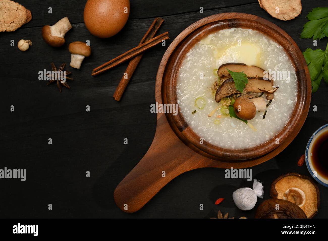 Traditional Chinese rice porridge with soft boiled egg, slice ginger ...