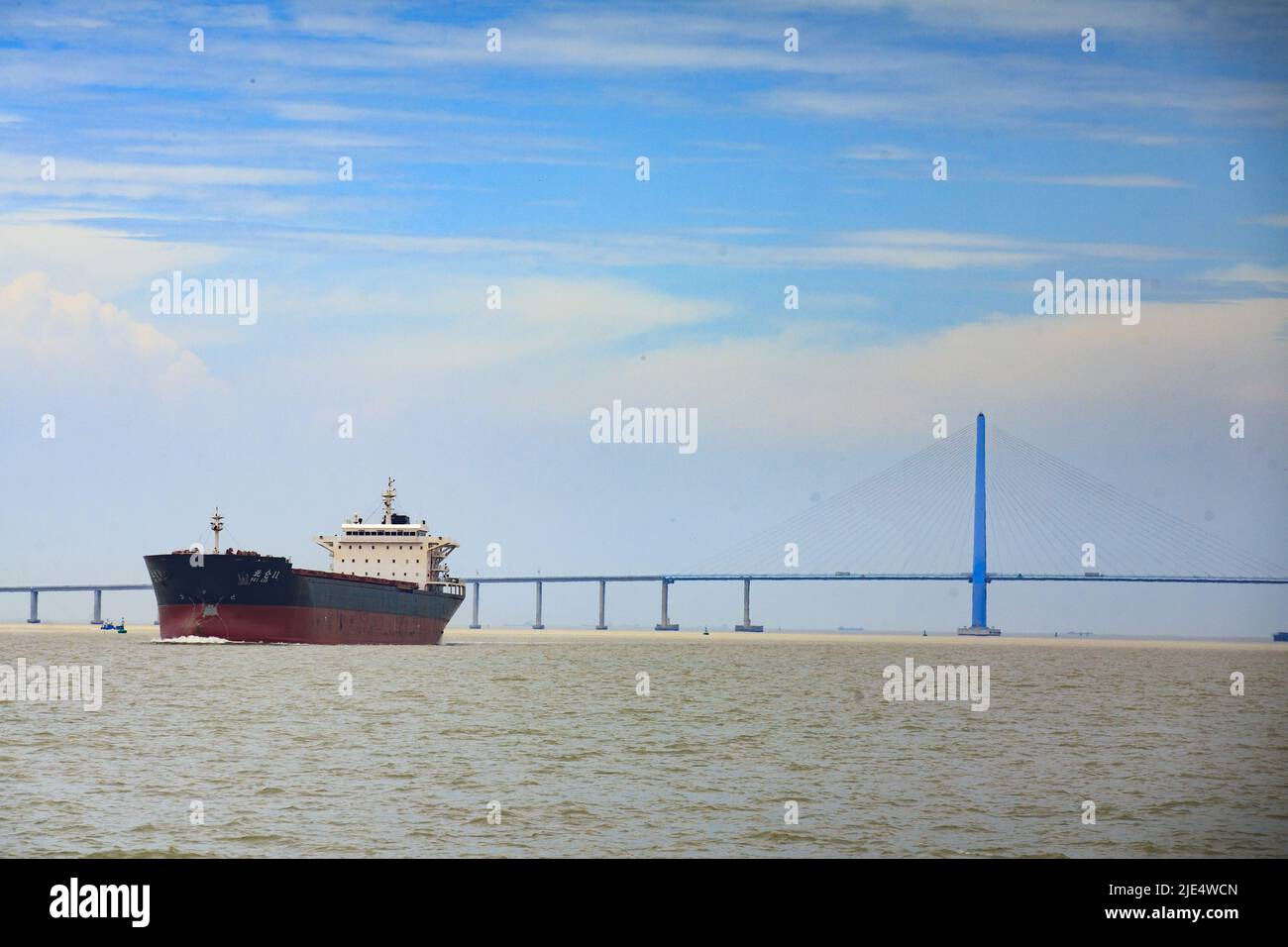 Jintang Bridge and sea traffic in Zhoushan, Zhejiang, with sunny blue ...
