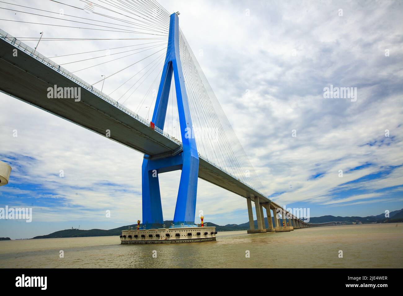 Jintang Bridge and sea traffic in Zhoushan, Zhejiang, with sunny blue ...