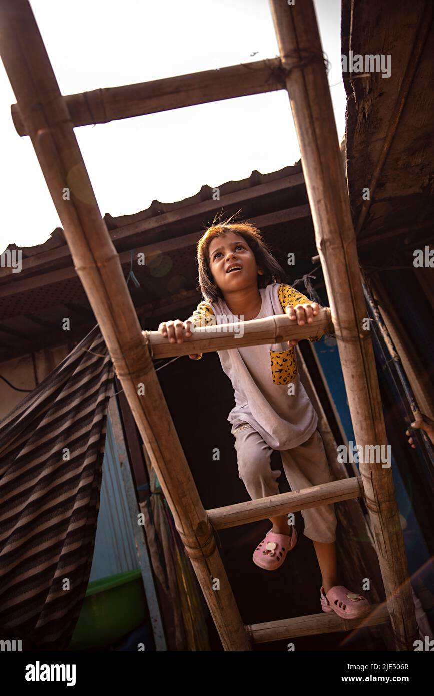 Child up ladder hi-res stock photography and images - Alamy