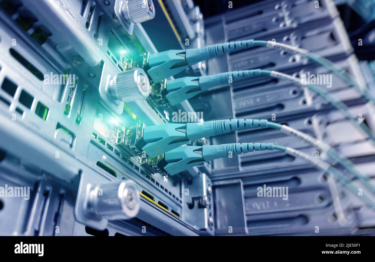 Optical connection. Cables pluged in network server Stock Photo - Alamy