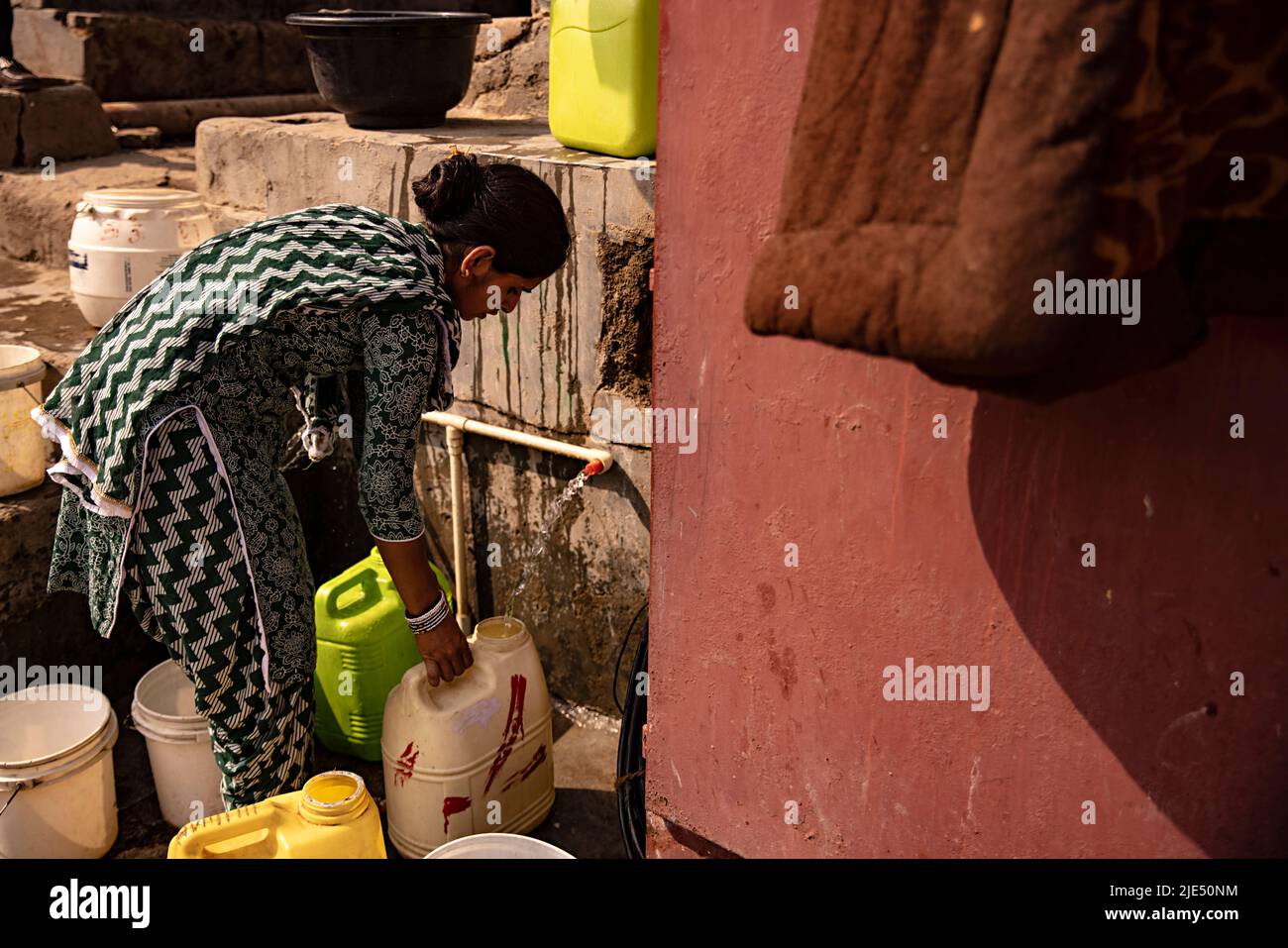 Filling water pot hi-res stock photography and images - Alamy