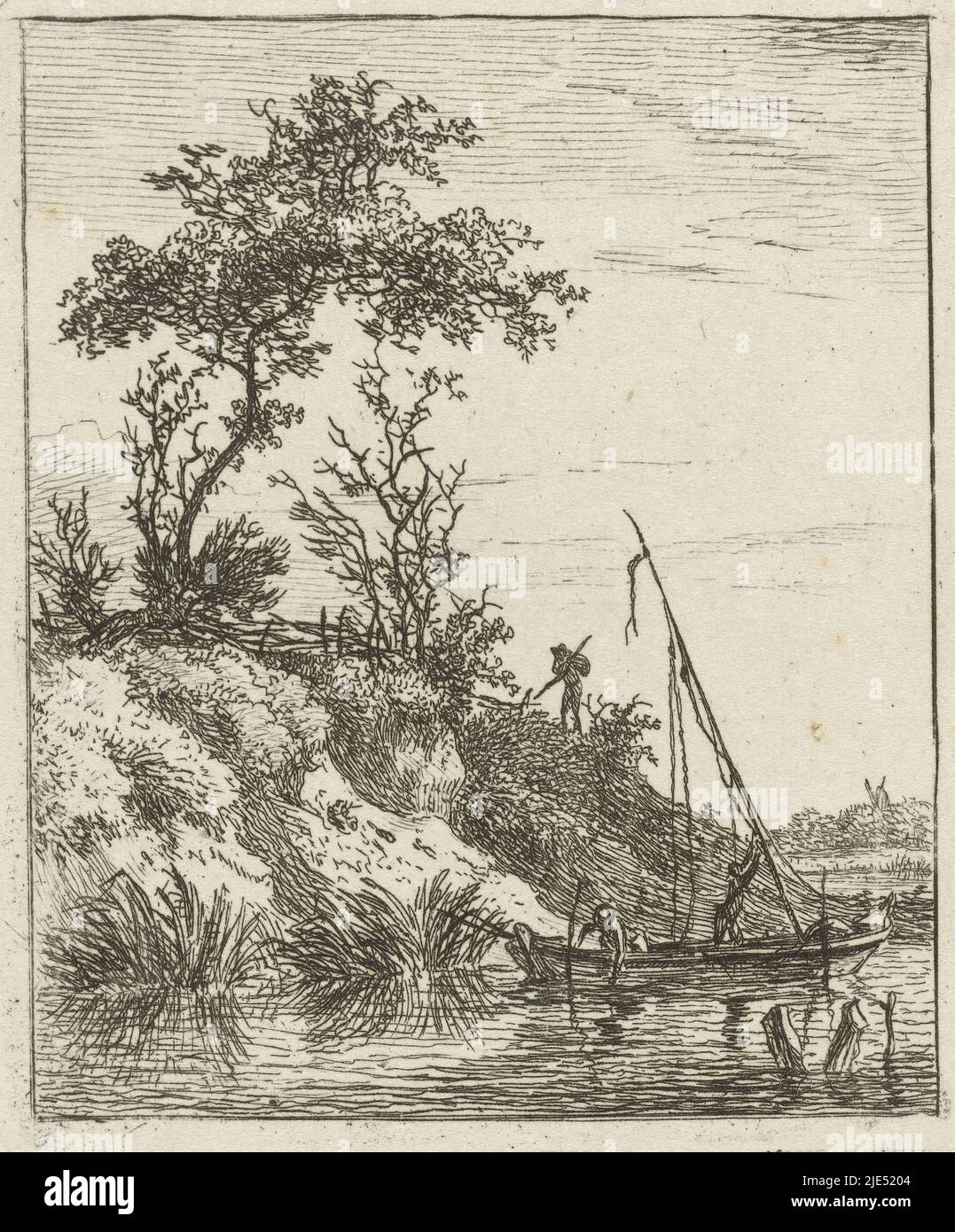 A face on a boat with two persons, one of which raises the mast. A man ...