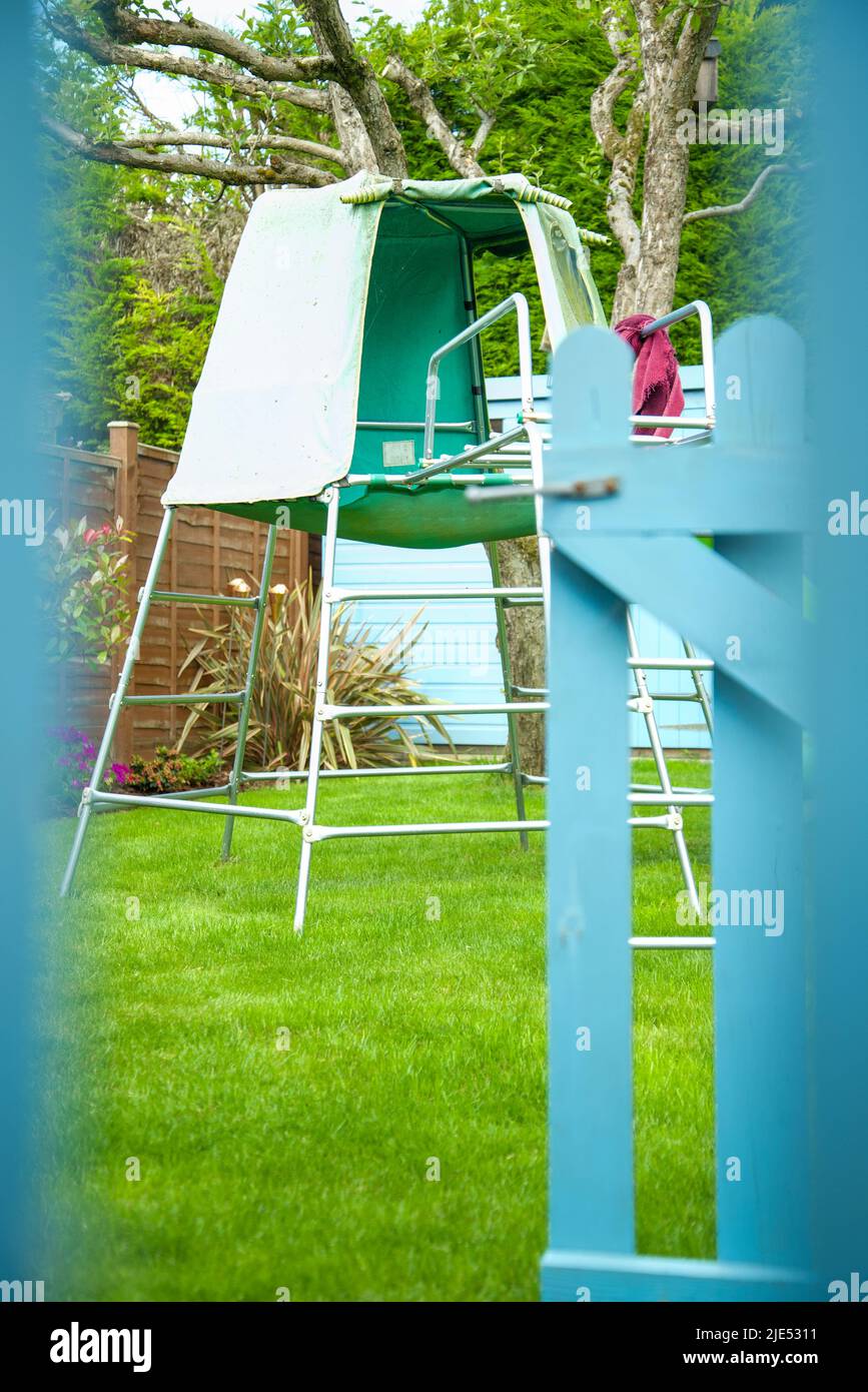Summer garden in England with kids playing apparatus Stock Photo - Alamy