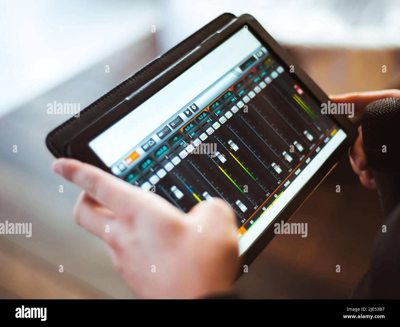 Mixing music on tablet with electronic music instruments concept Stock ...