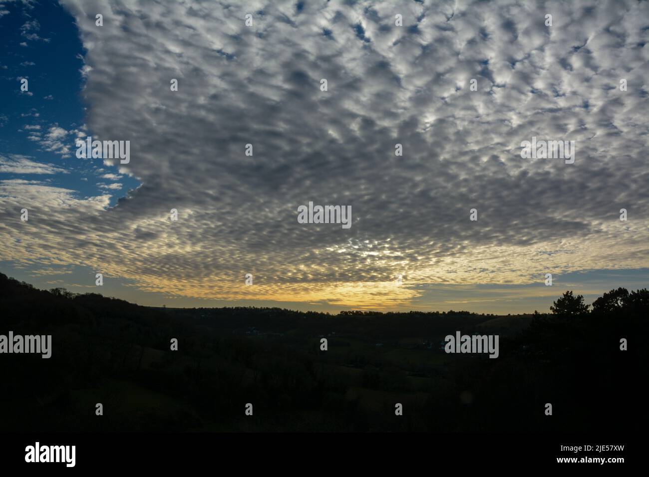 Attractive deck of altocumulus medium level cloud invading the skies ...