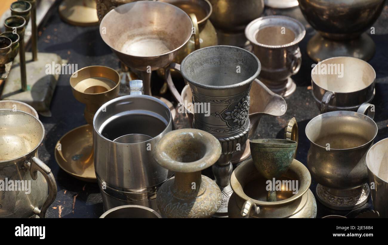 Bronze and metal objects sold on a street flee market. Antiquities at ...