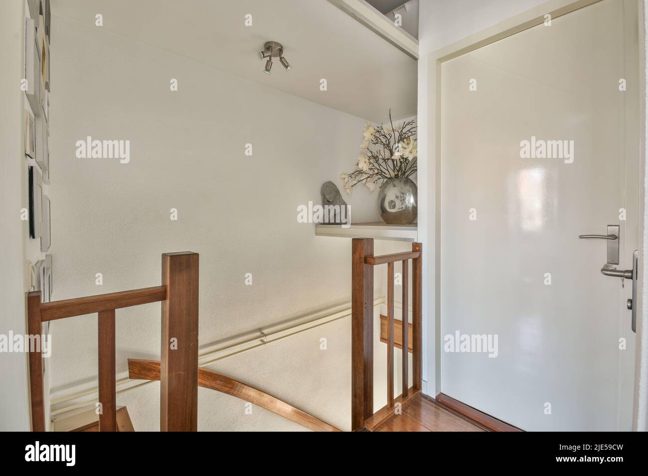 Spacious and minimalistic corridor with white walls and stairs Stock ...