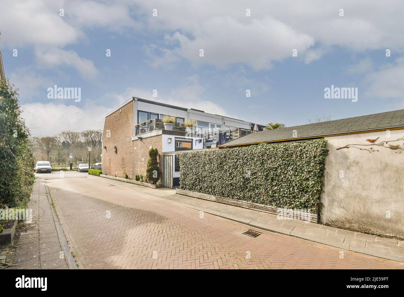 Empty road with bricks building hi-res stock photography and images - Alamy