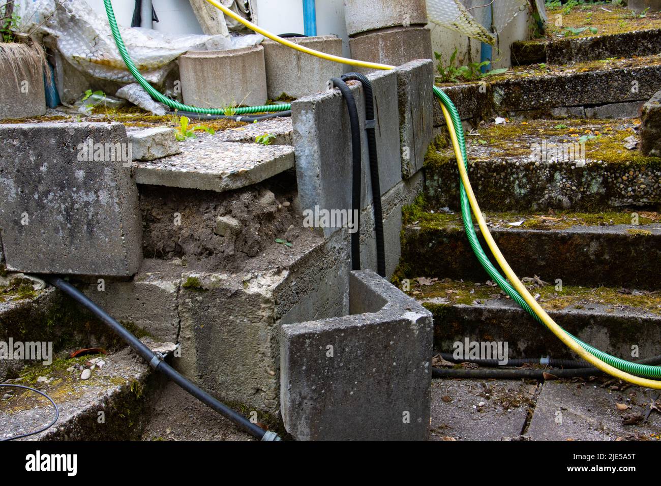 Concrete cornerstone broken out of a wall Stock Photo - Alamy