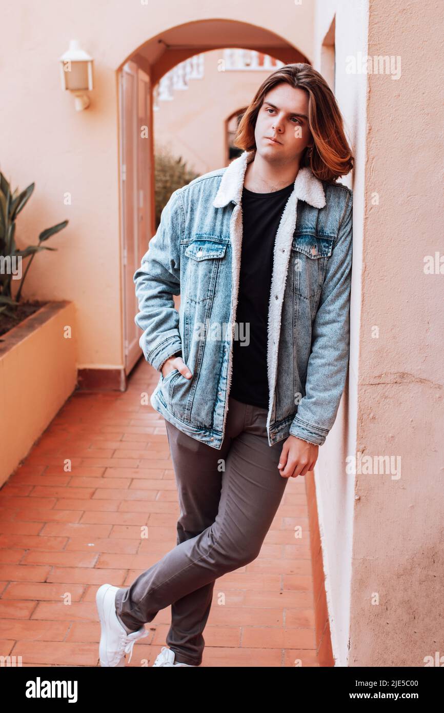 Lifestyle portrait of gen z teenage boy outdoors in empty street Stock ...