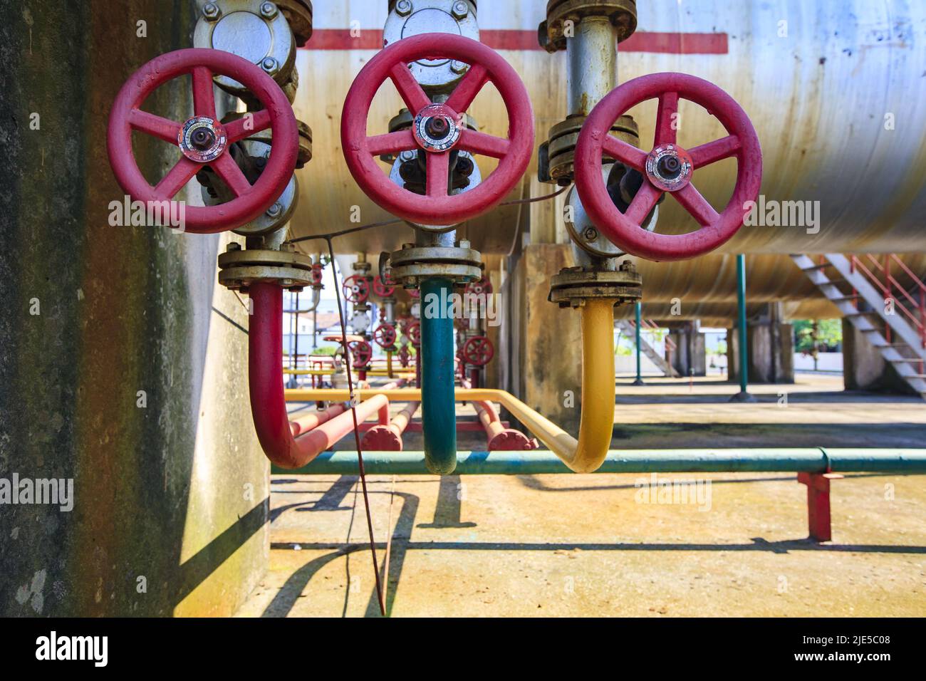 Industrial outdoor sunshine blue sky natural gas Stock Photo - Alamy