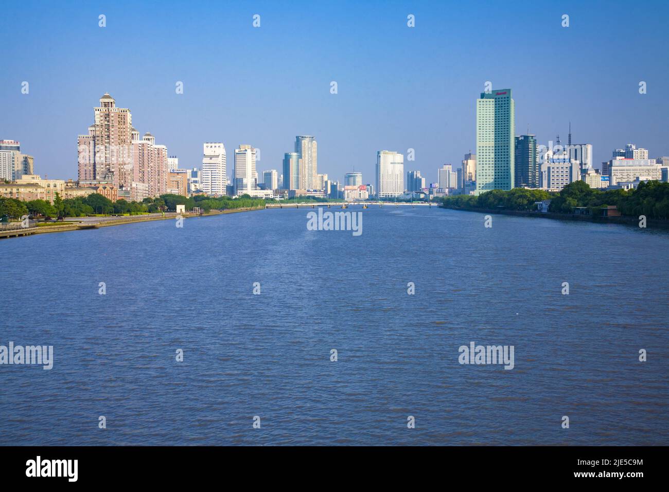 Urban high-rise buildings and sunshine reflection scenery of rivers in ...