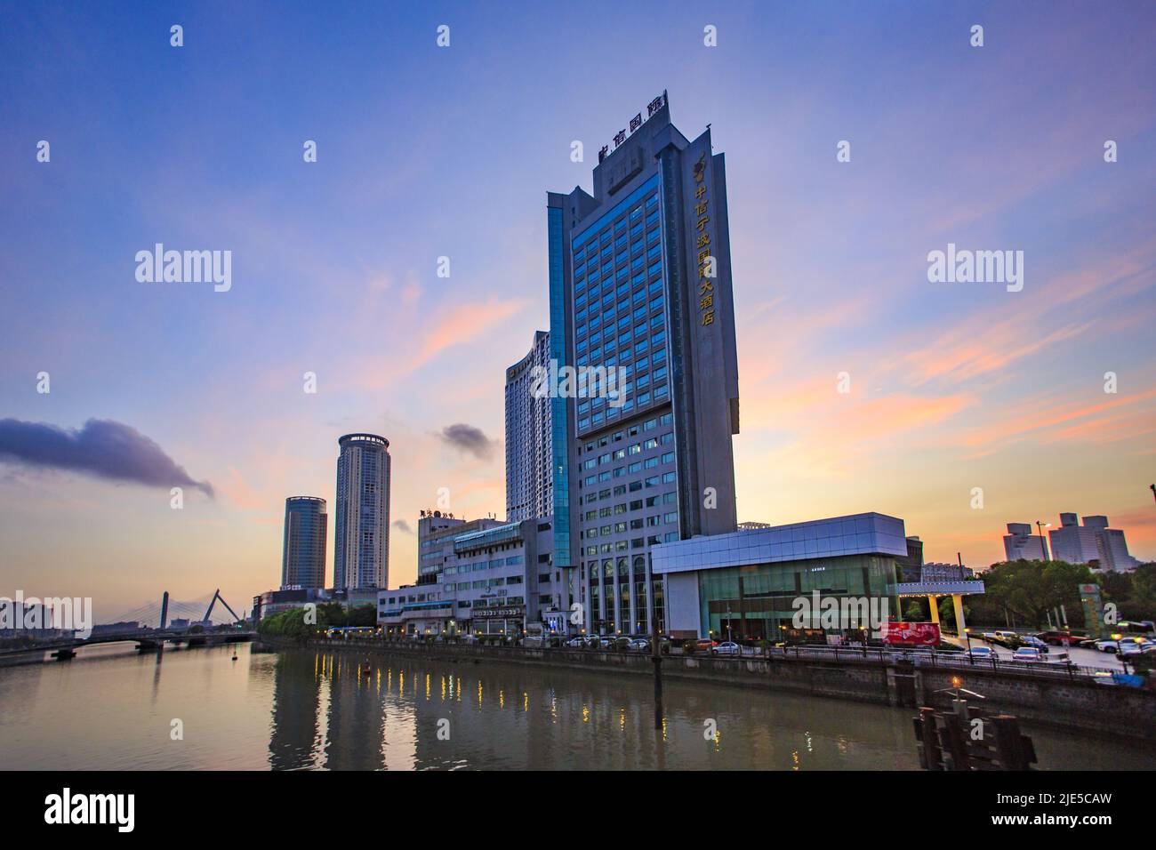 Urban high-rise buildings and sunshine reflection scenery of rivers in ...