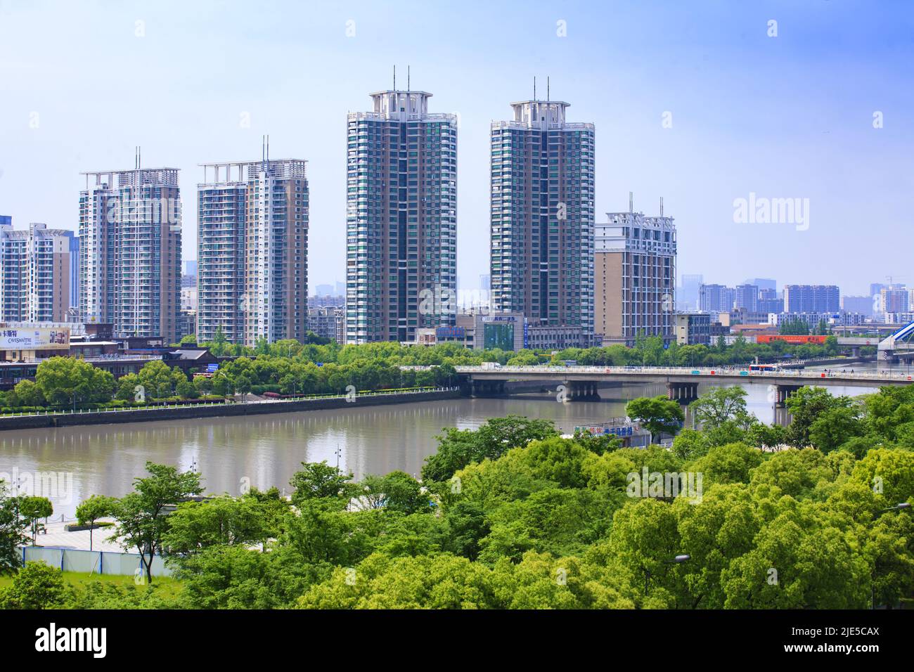 Urban high-rise buildings and sunshine reflection scenery of rivers in ...