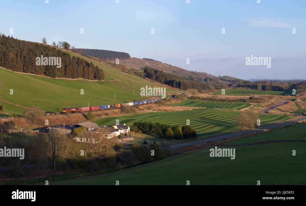 DB Cargo class 66 diesel locomotive 66164 hauling an intermodal ...