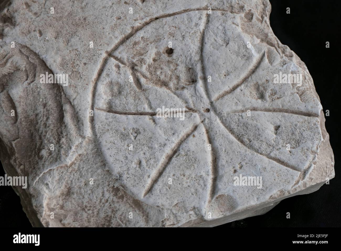 An ancient fragment shows a Byzantine cross carved in stone discovered ...
