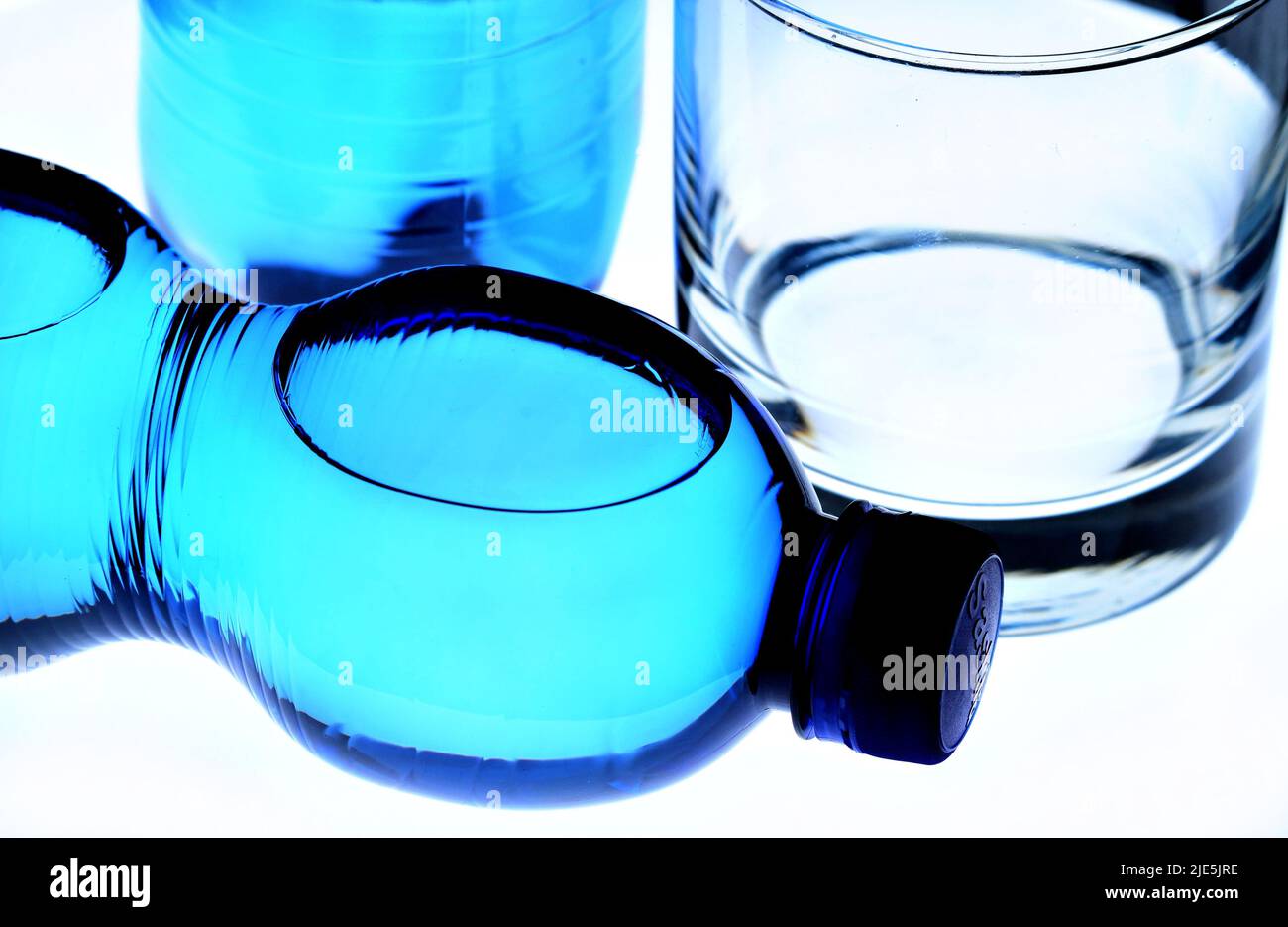 plastic water pet bottle with glass Stock Photo - Alamy