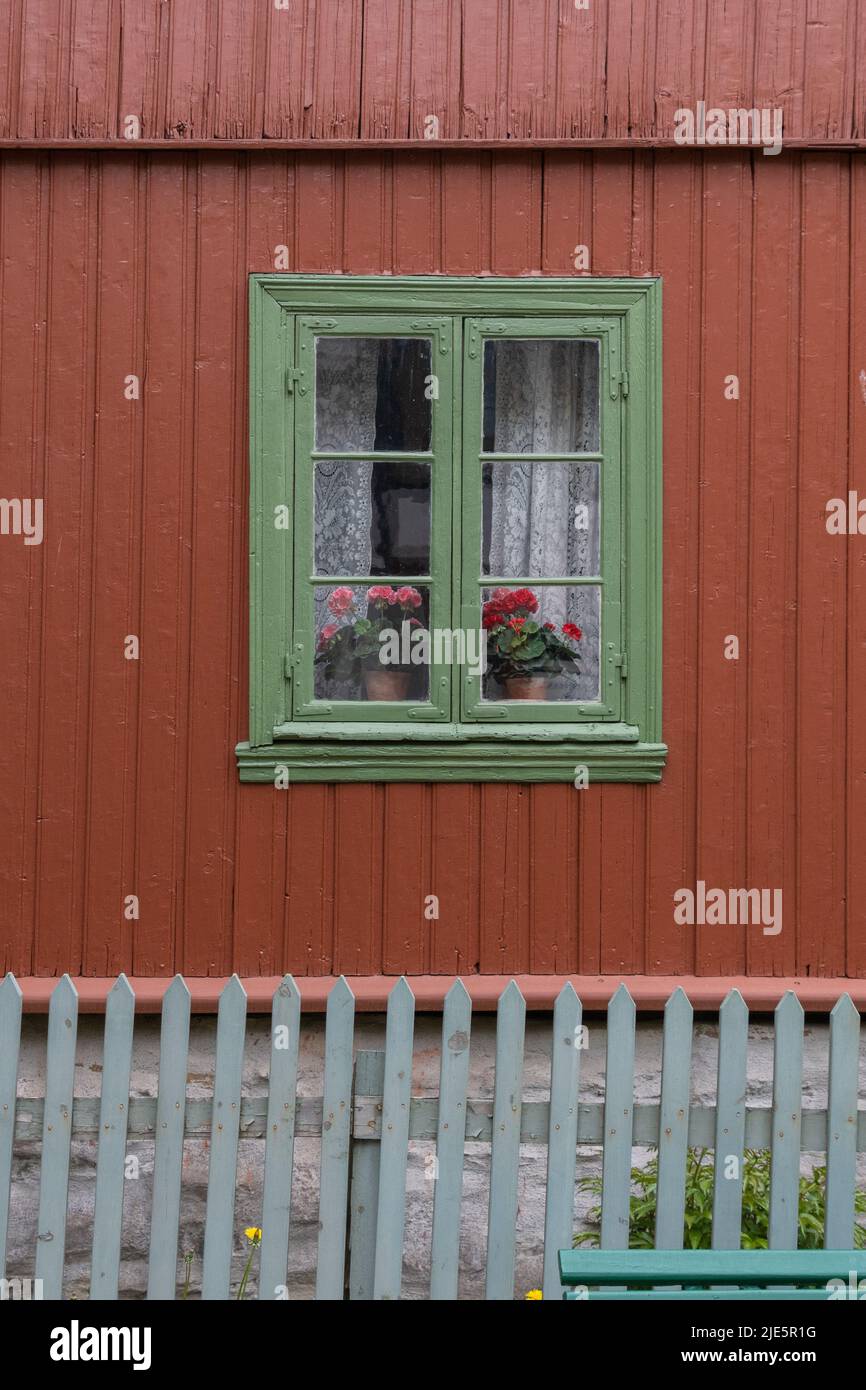 Green window frame on a red house at The Norwegian Museum of Cultural ...