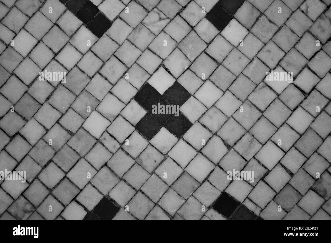 Elaborate vintage square marble tile pattern on the floor as a mosaic ...