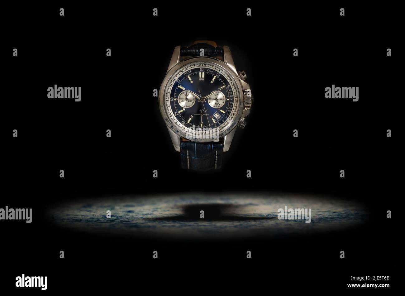 Studio shot of a blue fancy luxury unbranded Men watch on the black ...