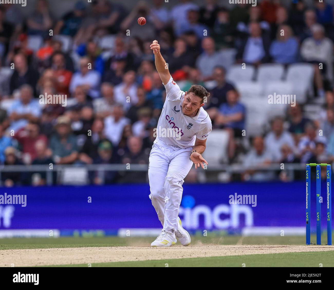 Matthew Potts of England delivers the ball to Tom Latham of New Zealand ...