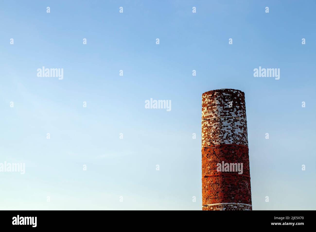 old chimney on the roof of the building, old heating system with a ...