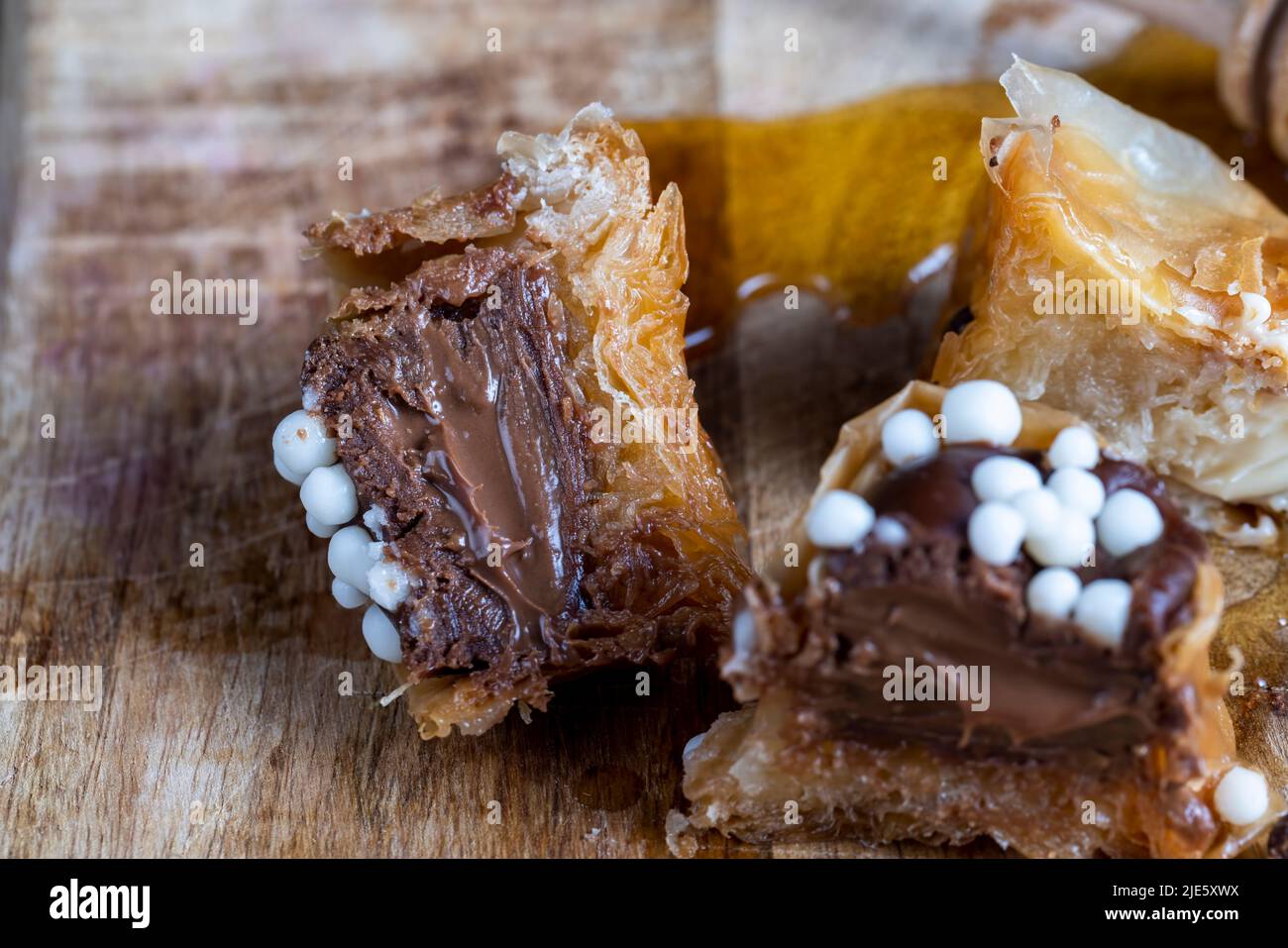 sweets made of thin puff pastry with chocolate filling and honey ...