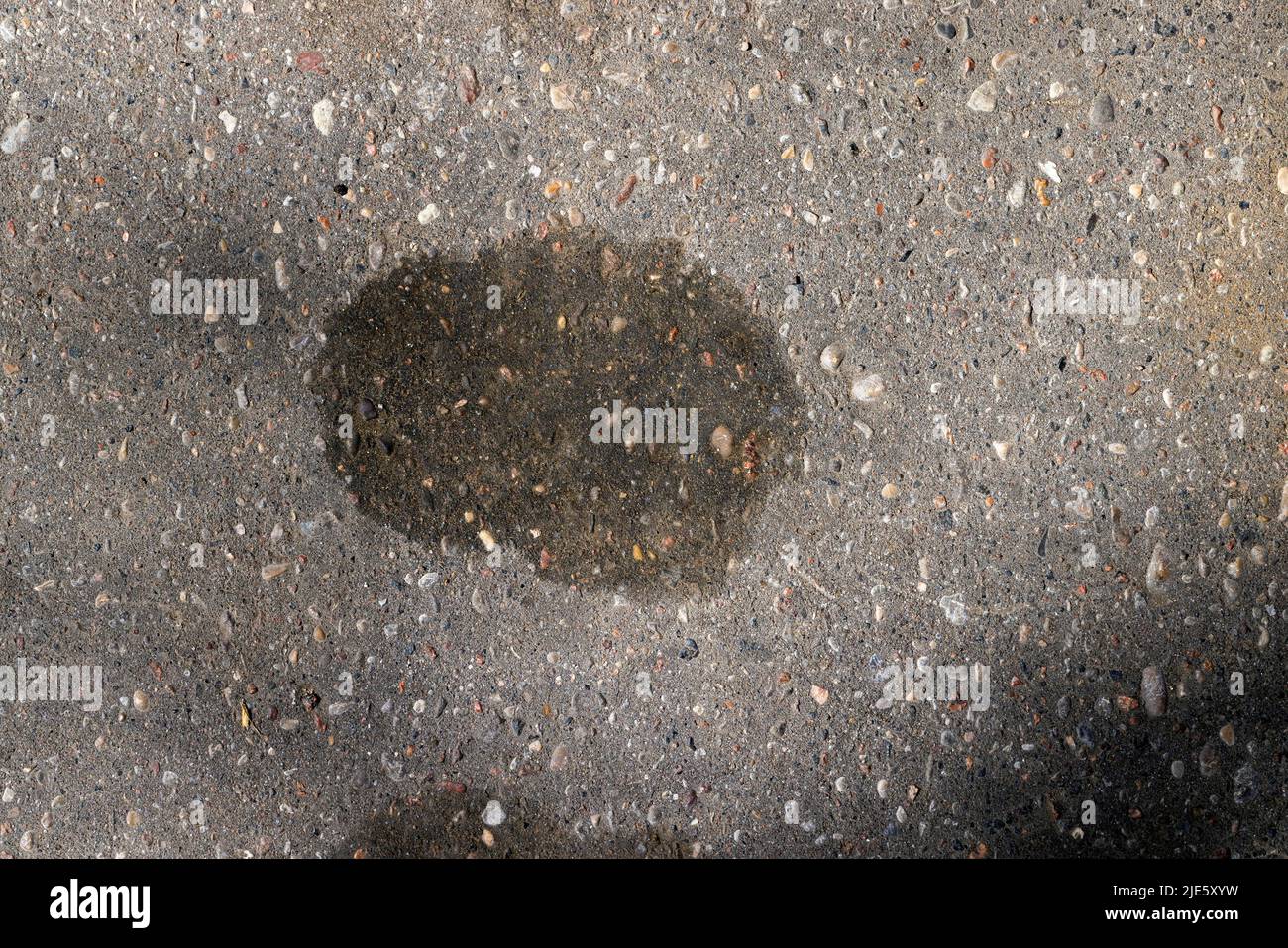 a highway with oil stains on the surface, a polluted highway from ...