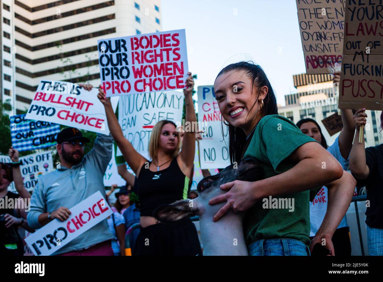 A woman holds a sheep during Scotus protest. Protestors gather after ...