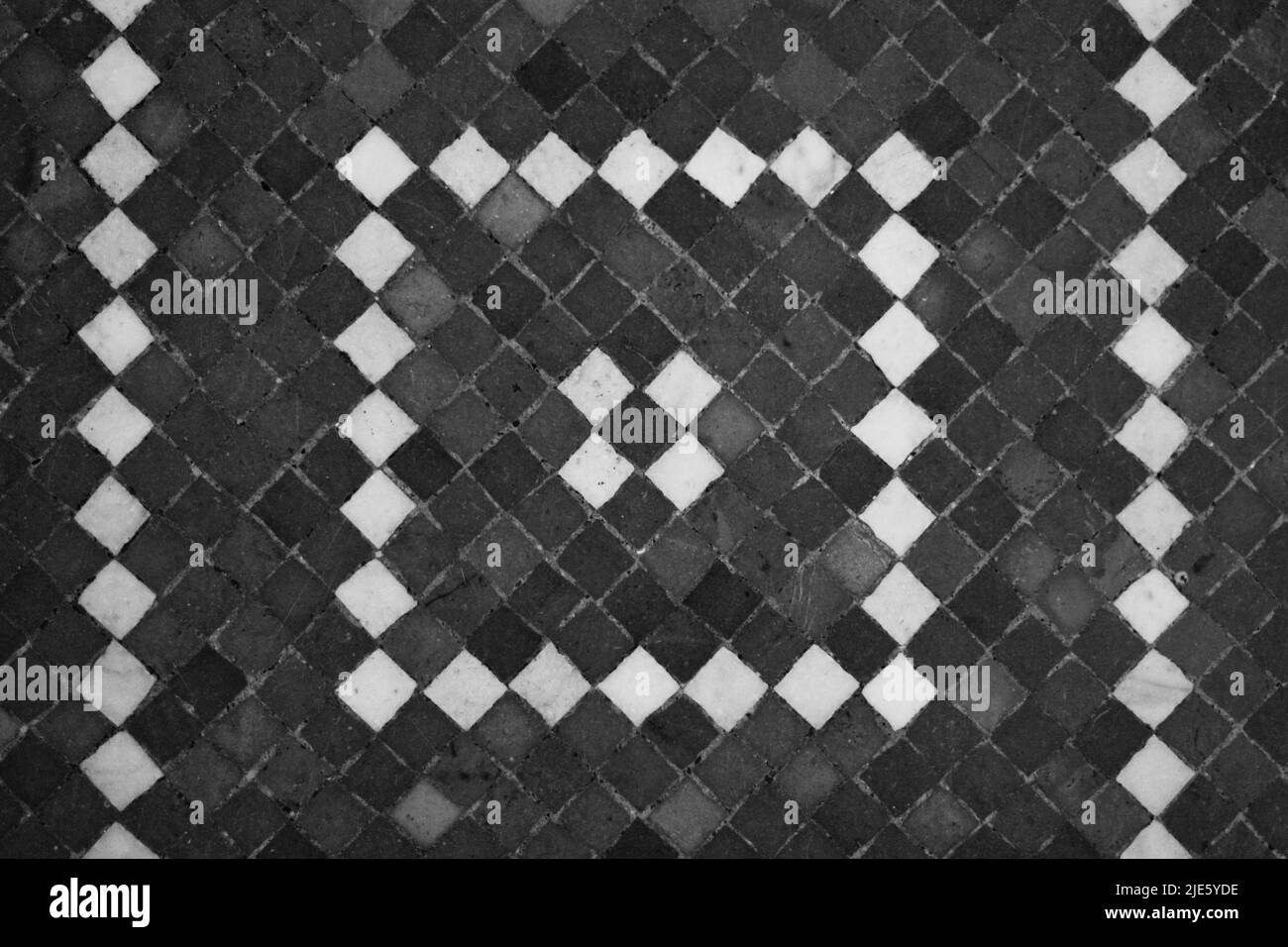 Elaborate vintage square marble tile pattern on the floor as a mosaic ...