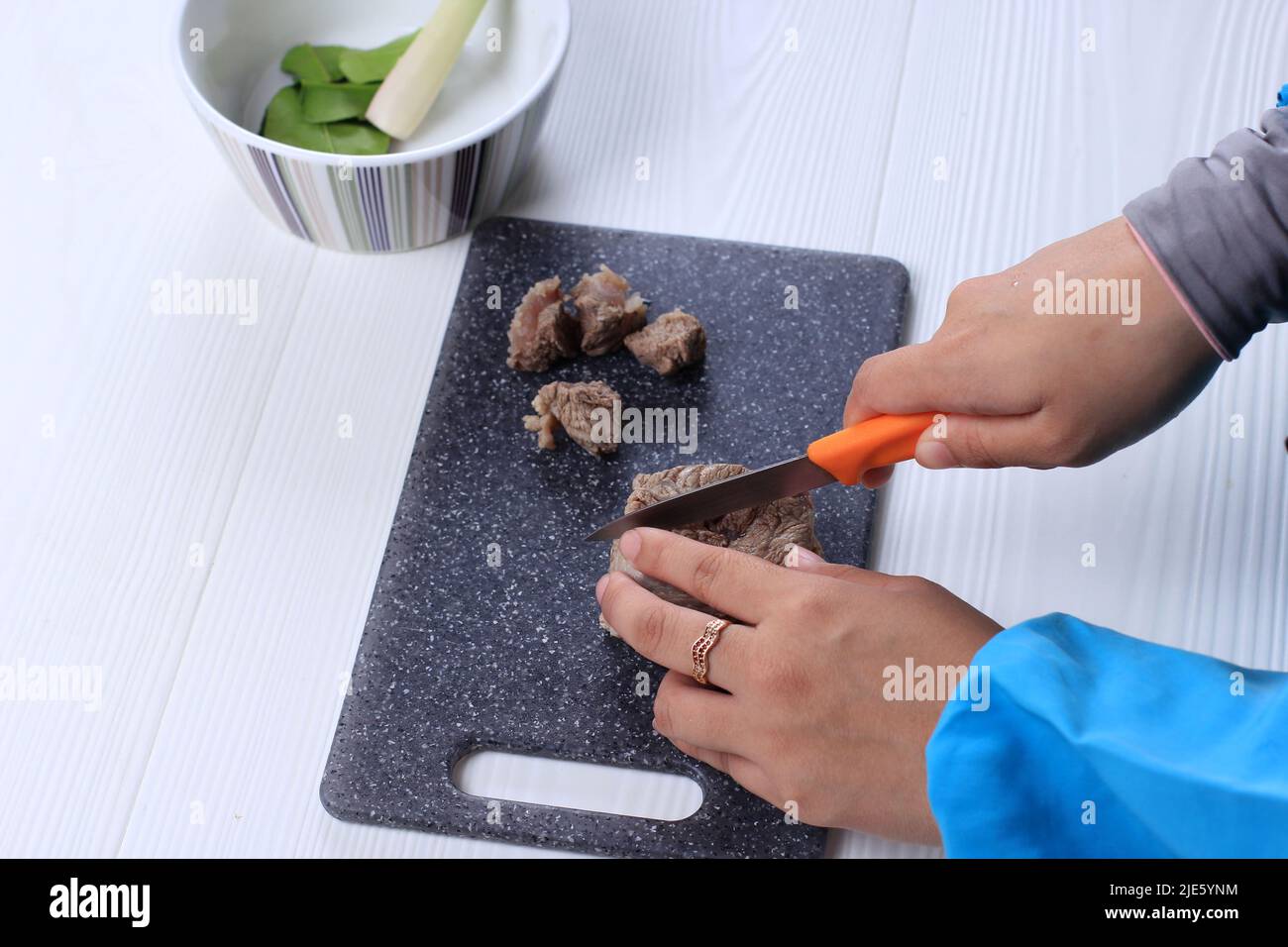 Female Hand Cut Beef in to Cube Preparing Idul Adha or Ied Al Adha ...