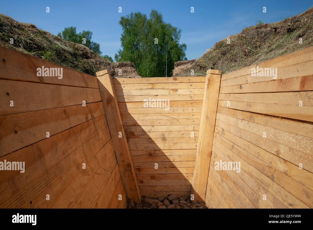 dug in the ground and reinforced with improved boards trench ...