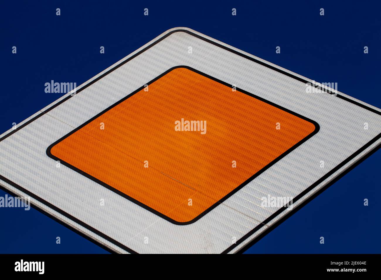 automobile road sign indicating the main road, yellow and white car ...