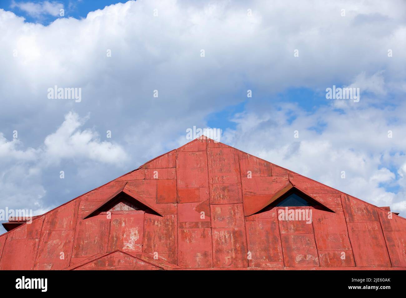 part of the old metal roof painted in red, part of the roof of the ...